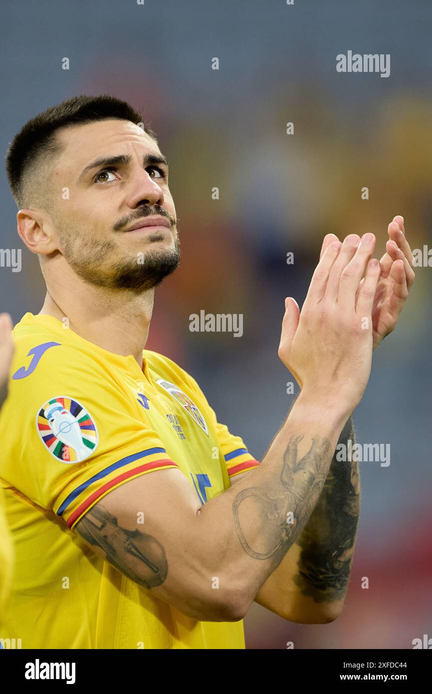 Munich, Germany. 2nd July, 2024. Andonie Andrei Burca of Romania greets ...