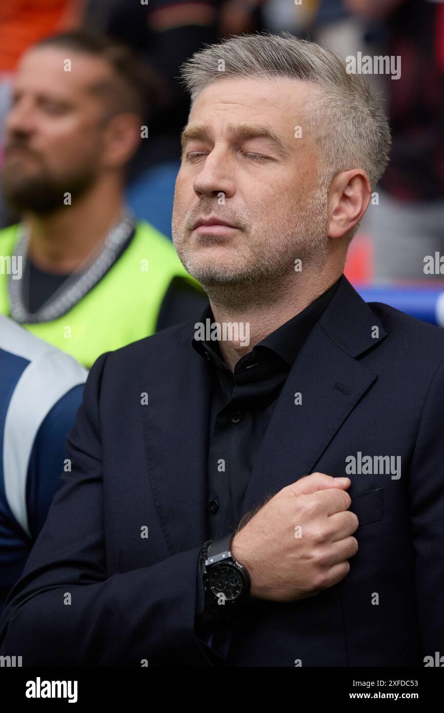 Munich, Germany. 2nd July, 2024. Romania's head coach Edward Iordanescu ...