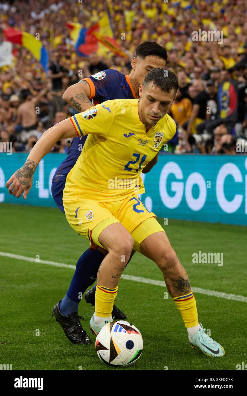 Munich, Germany. 2nd July, 2024. Nicolae Claudiu Stanciu (front) of ...