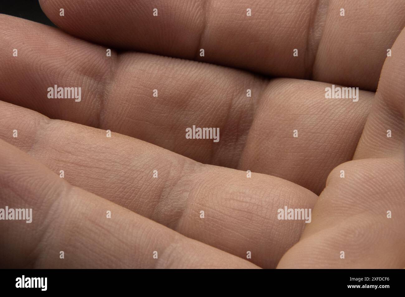 Close up of an adults hand showing finger prints, marks, wrinkles on ...