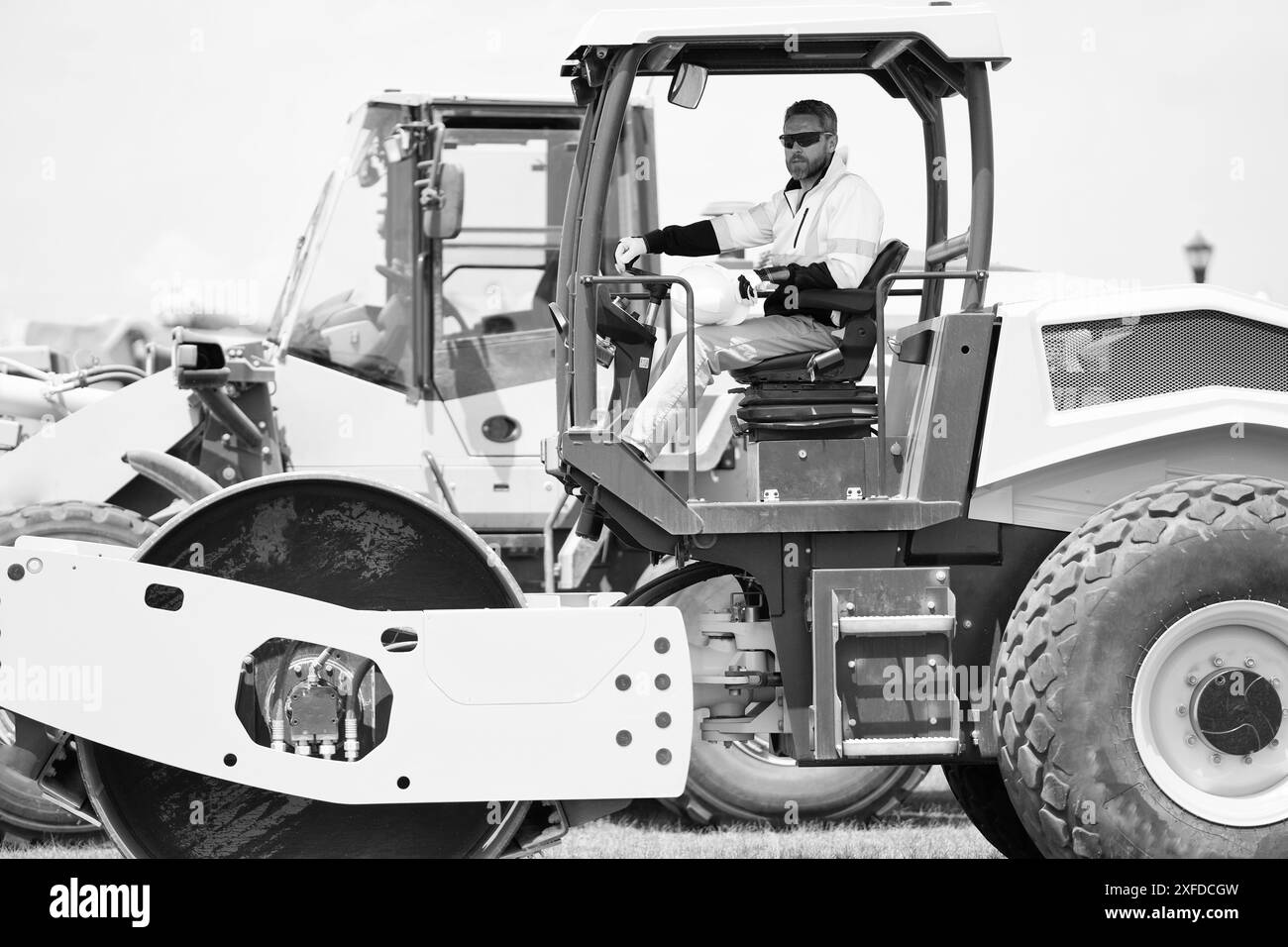 Man compactor Black and White Stock Photos & Images - Alamy