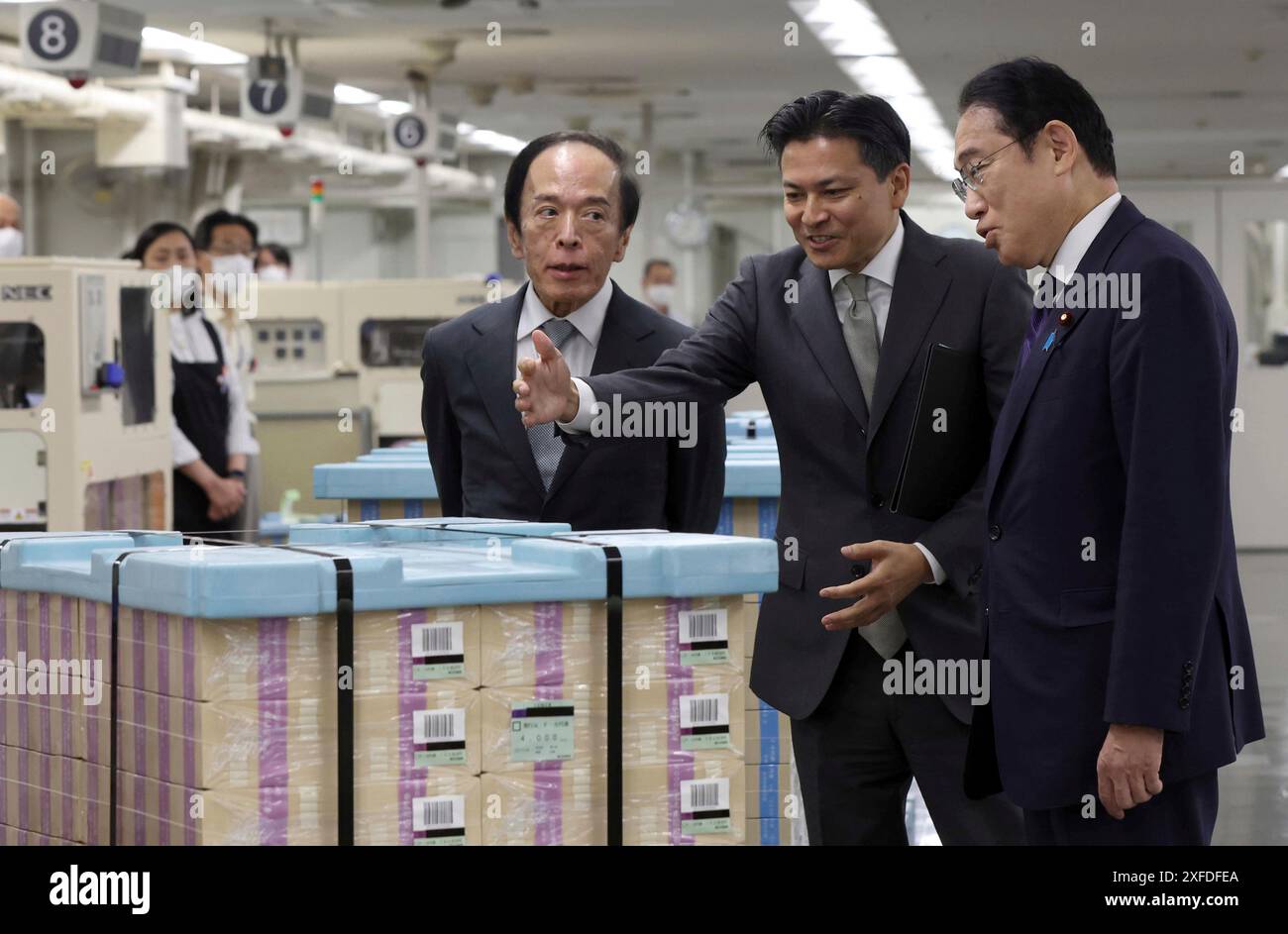 Japan's Prime Minister Fumio Kishida(R) receives an explanation of new ...