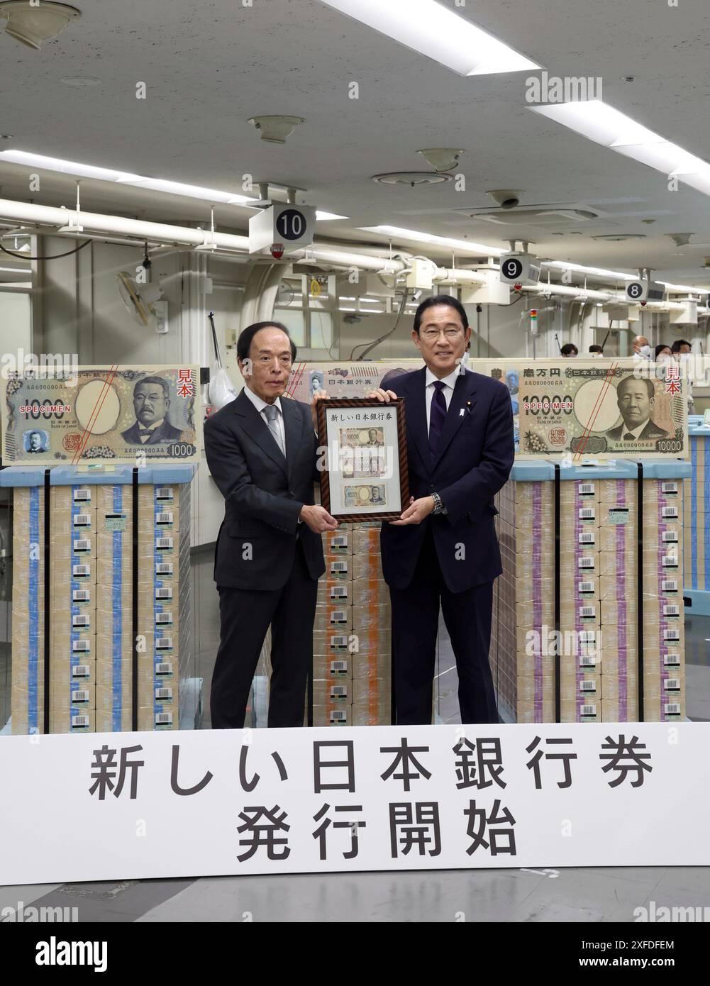Japan's Prime Minister Fumio Kishida(R) and Bank of Japan's governor ...