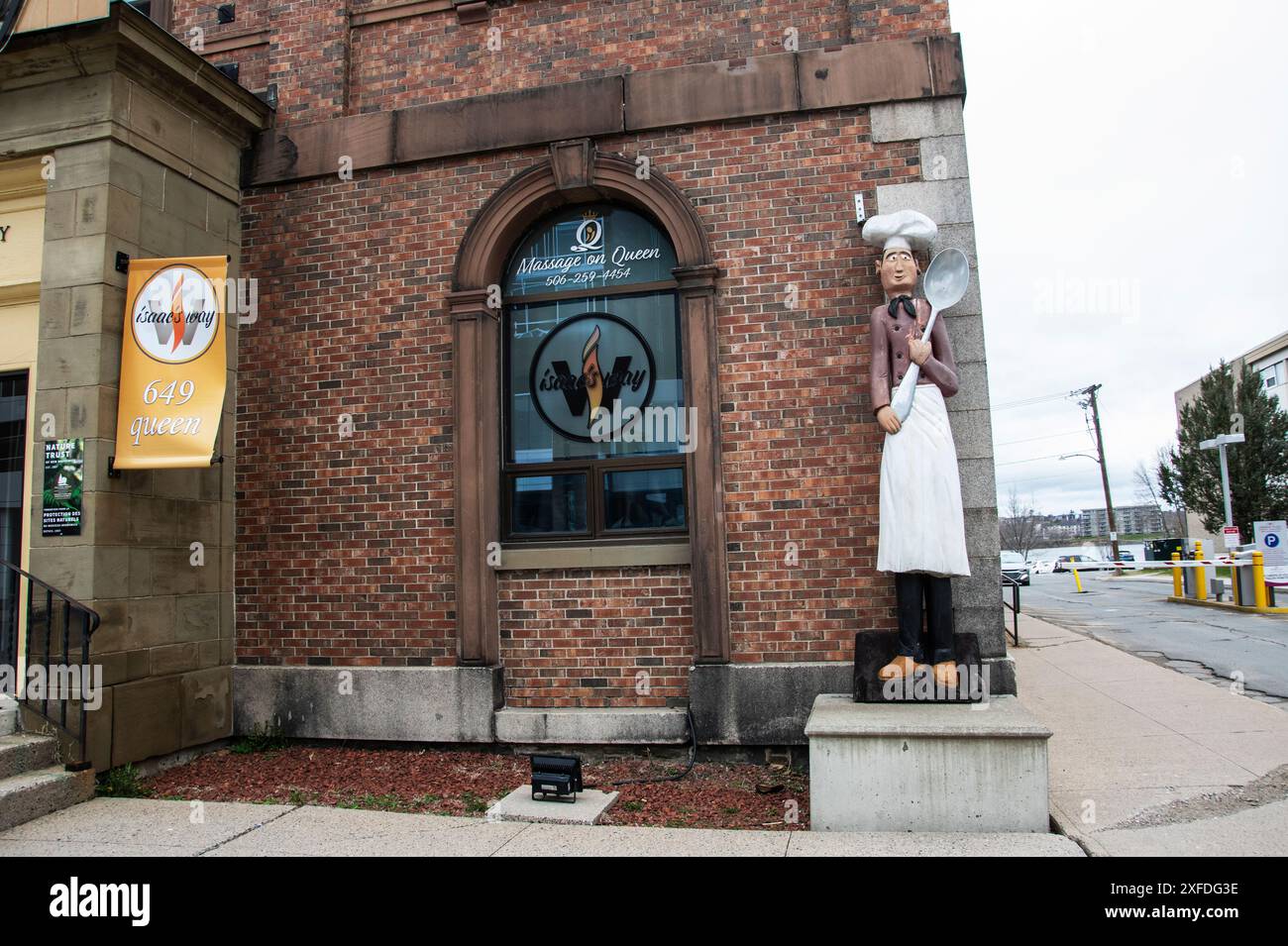 Statue of a chef carrying a spoon at Isaac's Way restaurant on Queen ...