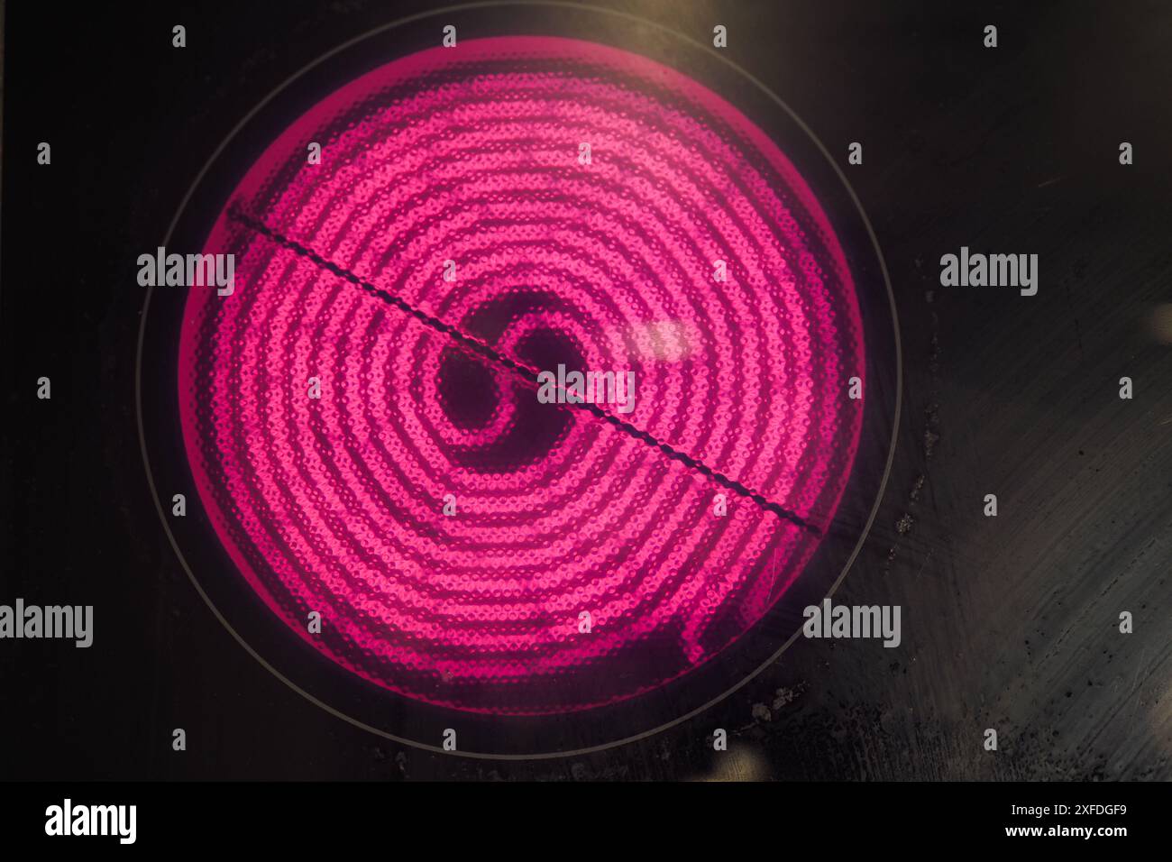 The Electric Stove Coil Element emits a warm glow while cooking ...