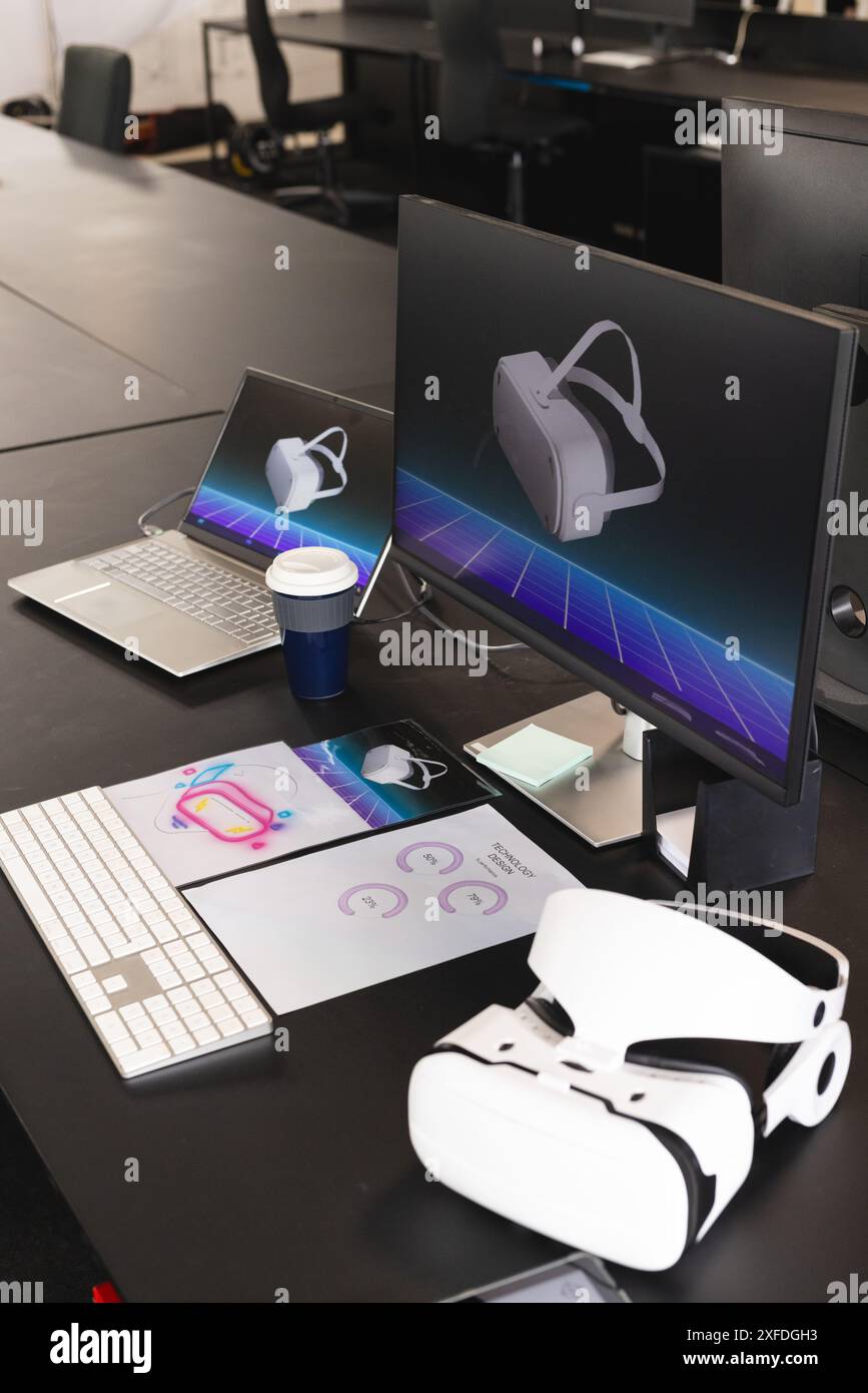 VR headsets and laptops on office desk for business presentation and ...