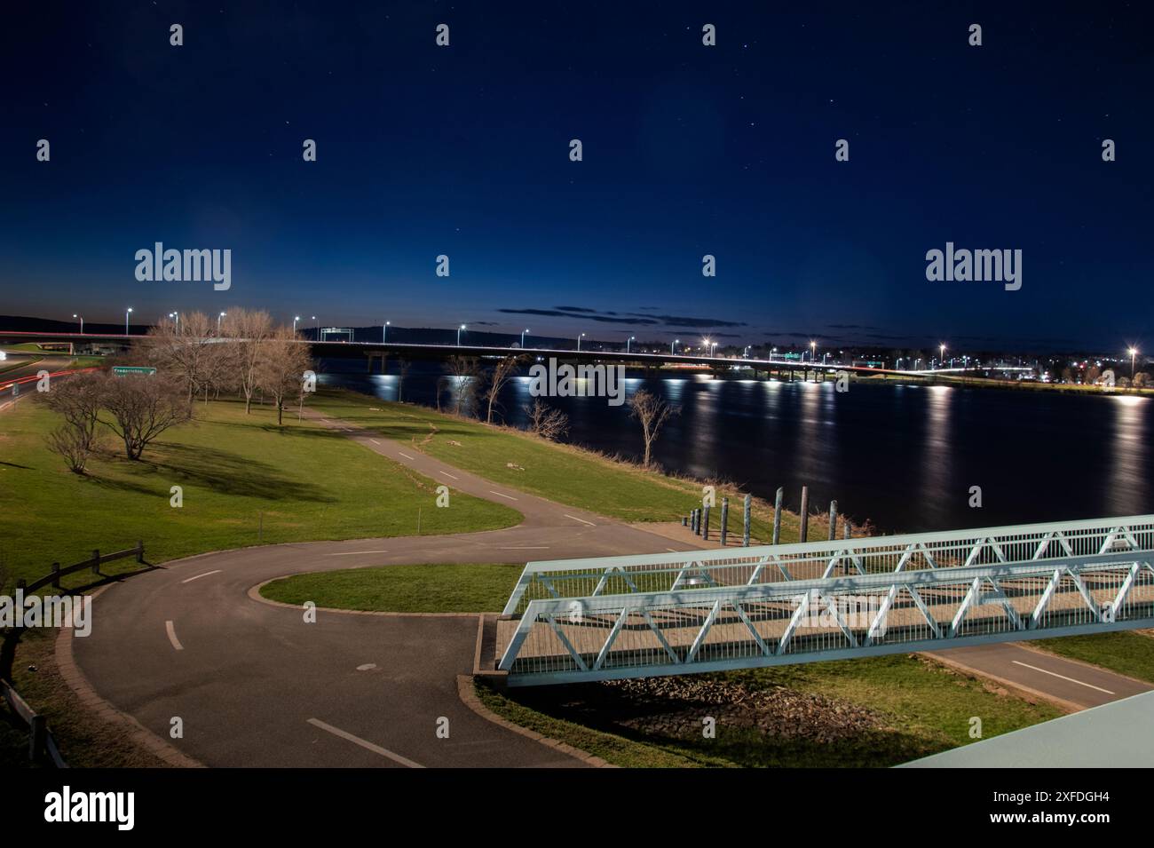 Car trails on the Westmorland Bridge in Fredericton, New Brunswick ...