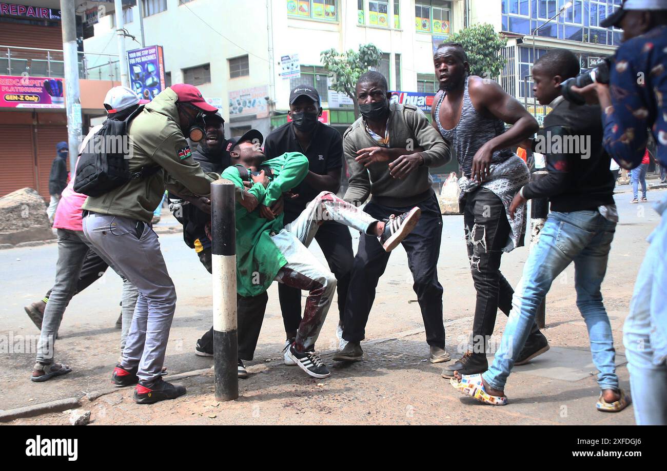 Nairobi, Nairobi, Kenya. 2nd July, 2024. Protesters helping a man who ...