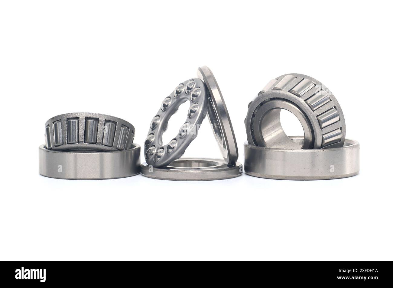 Single row tapered roller bearings and thrust ball bearings isolated on ...