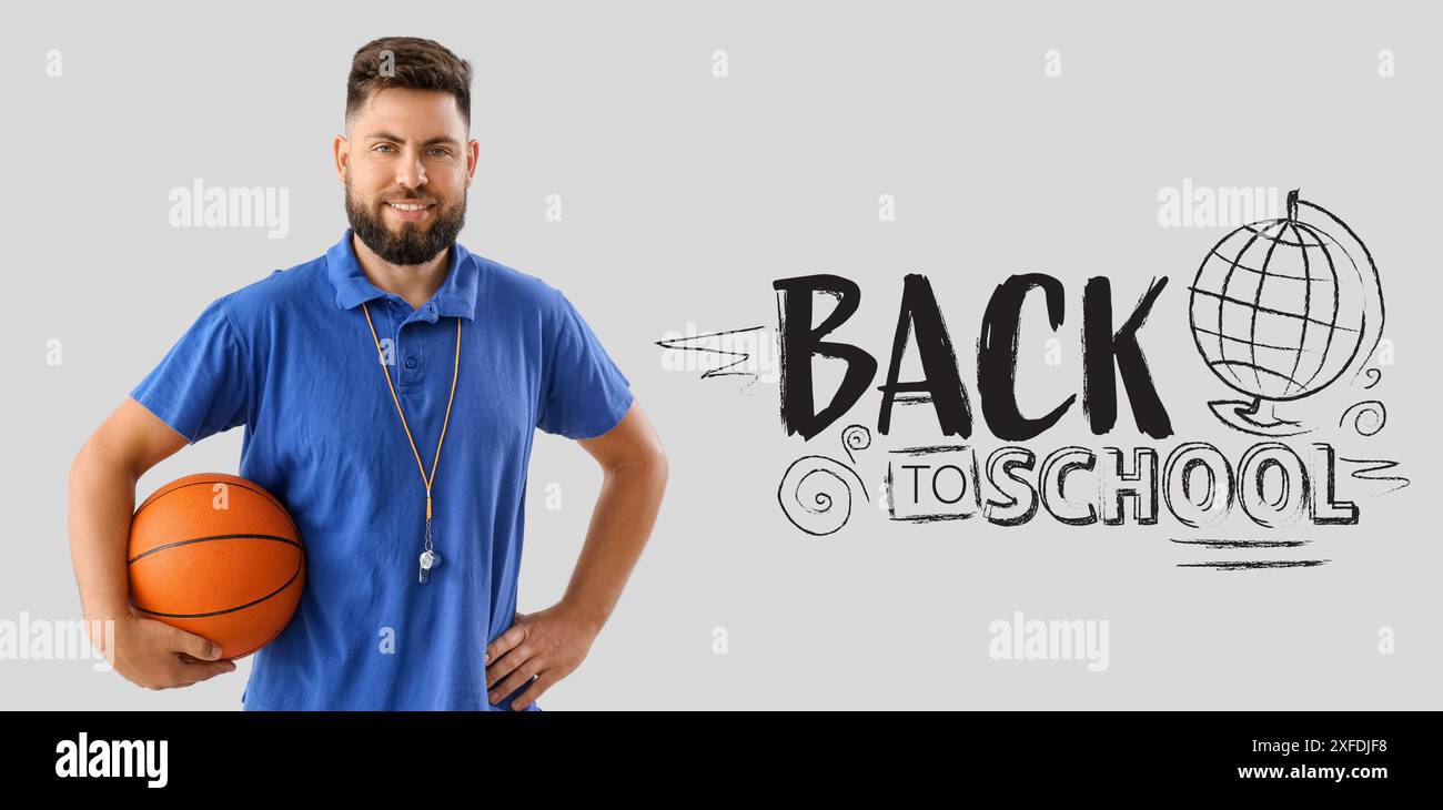 Male PE teacher with ball and text BACK TO SCHOOL on light background ...