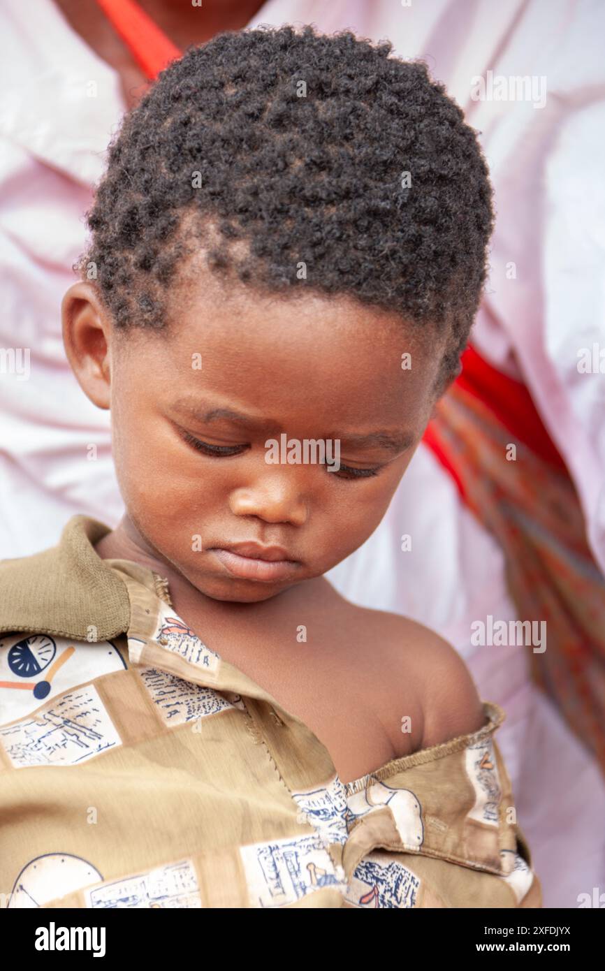 african san child held by his mother, village in Botswana Stock Photo ...