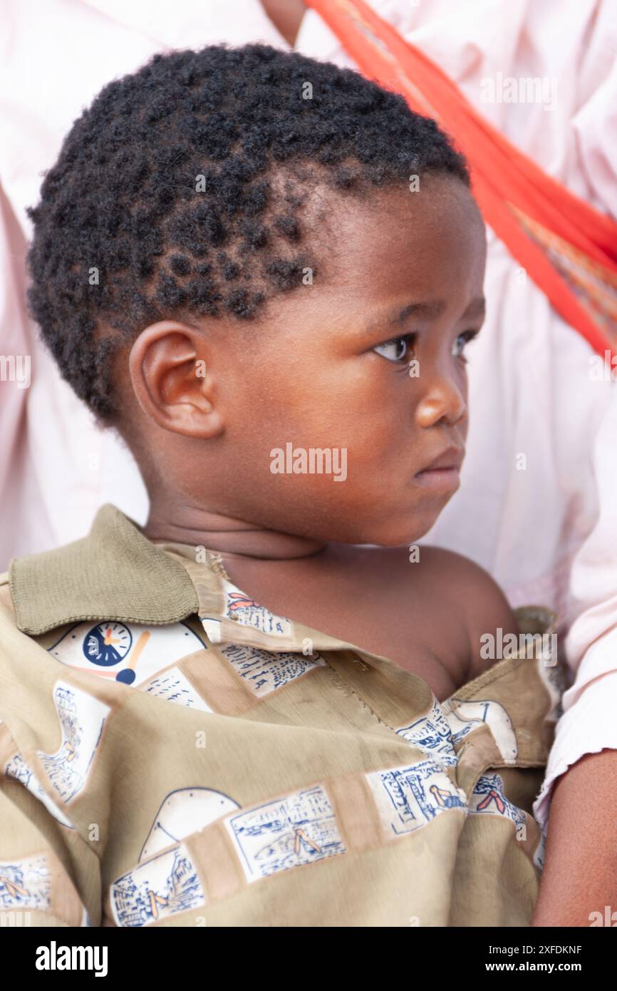 african san child held by his mother, indigenous peoples of Southern ...
