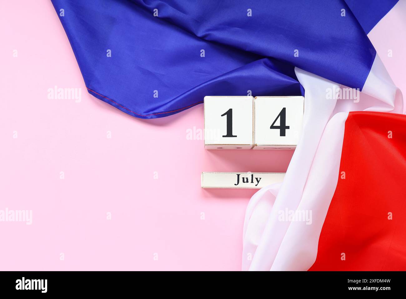 Flag of France and cube calendar with date 14 JULY on pink background ...