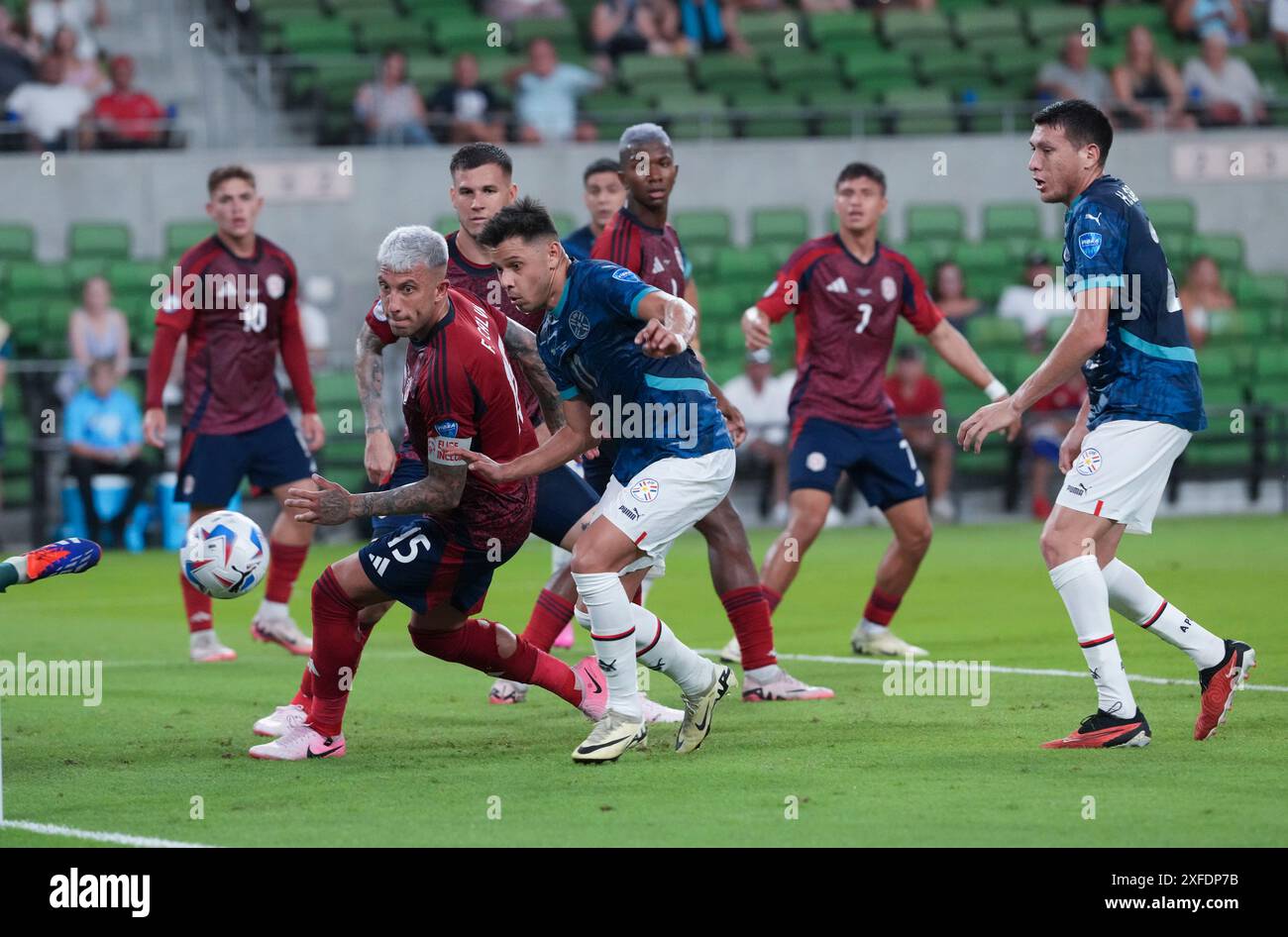 Costa Rica's FRANSISCO CALVO (15) battles ANGELO ROMERO (11, blue) of ...