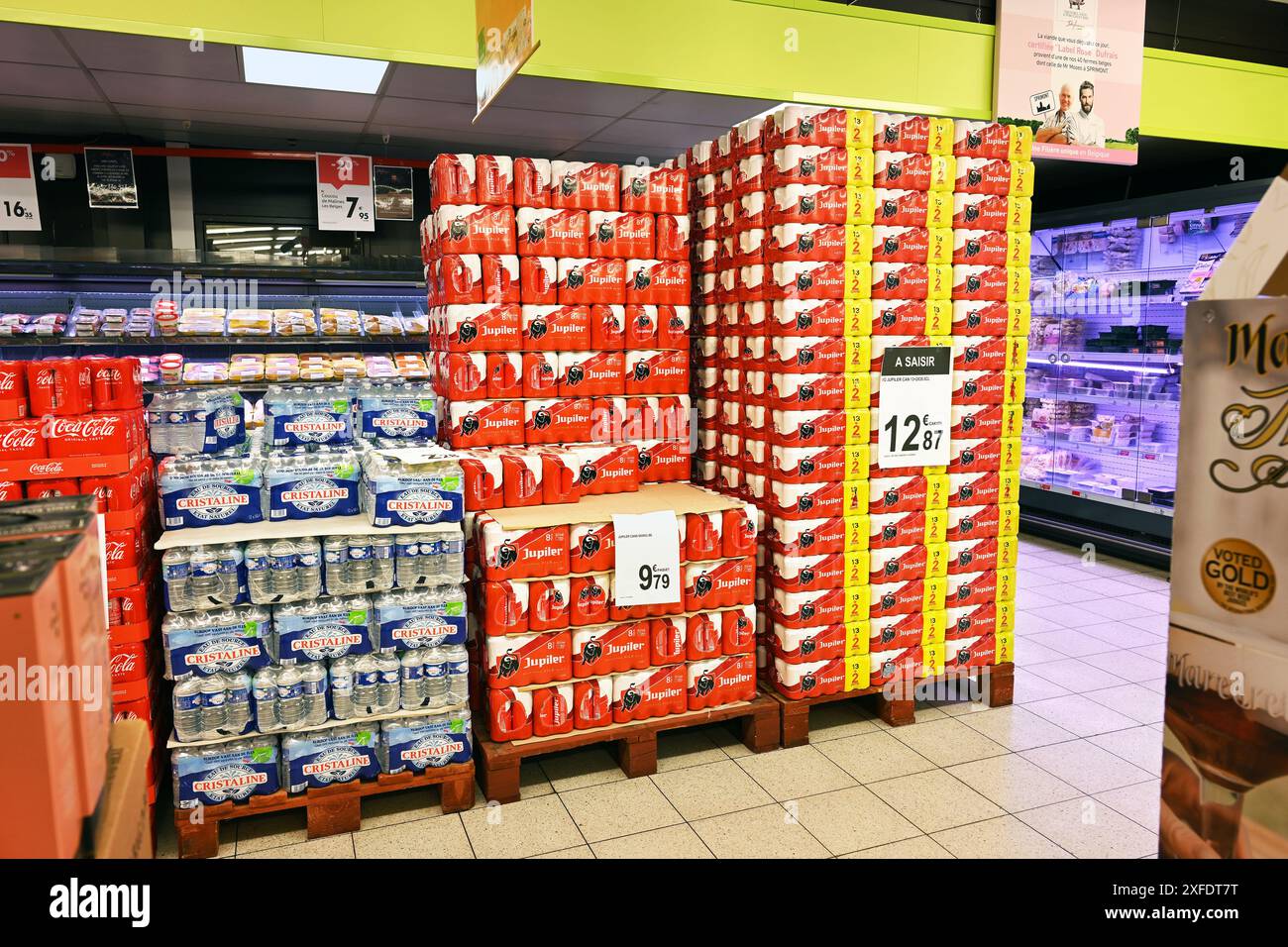 Pallets with beverage cans in a grocery Stock Photo - Alamy