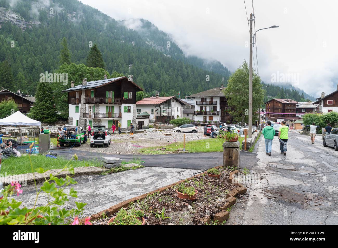 Overflowing of a river, flooding and landslides among houses of a ...