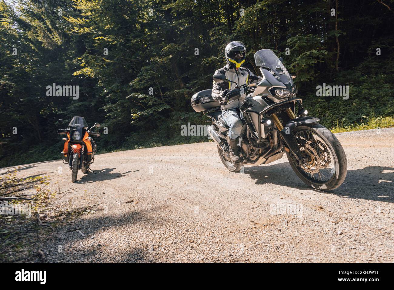 Modern adventure motorcycle on a ride on gravel surface. Motorcycling ...
