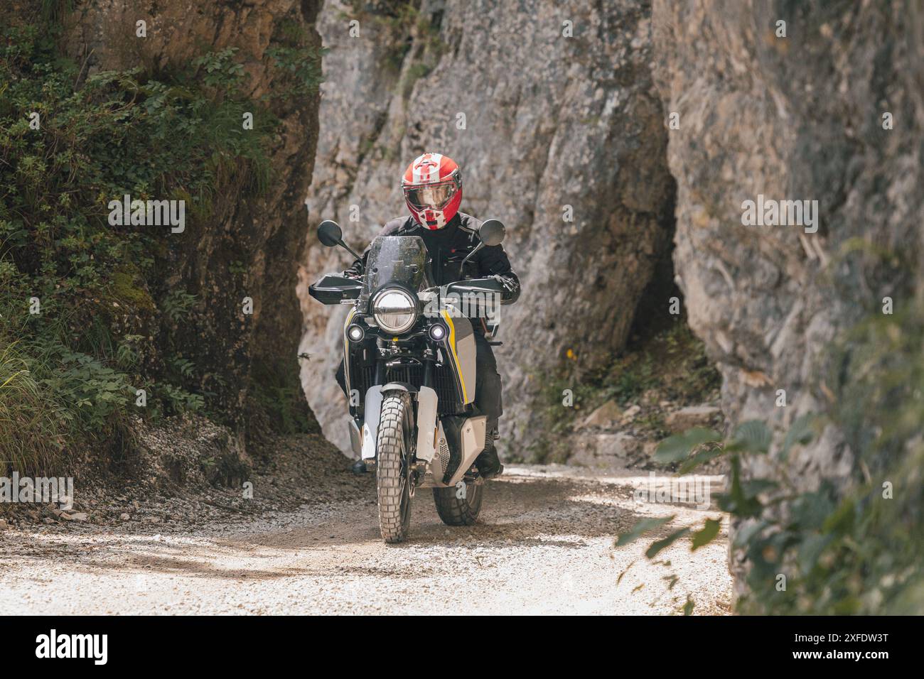 Modern adventure motorcycle on a ride on gravel surface. Motorcycling ...