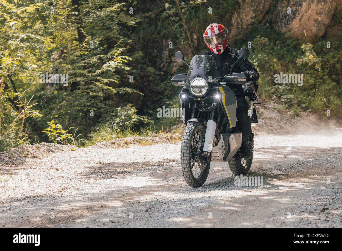 Modern adventure motorcycle on a ride on gravel surface. Motorcycling ...