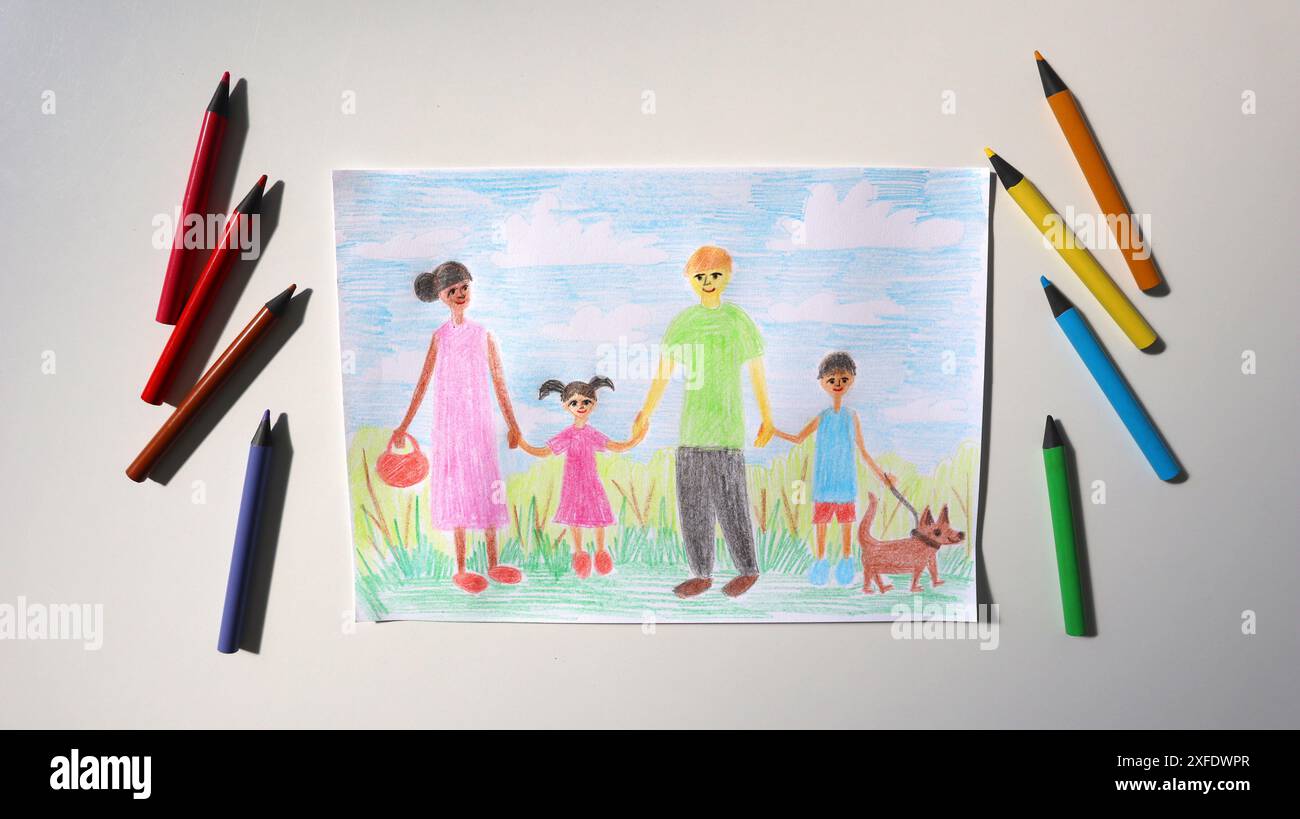 Photo of child's drawing with colored pencils. Picture shows family ...