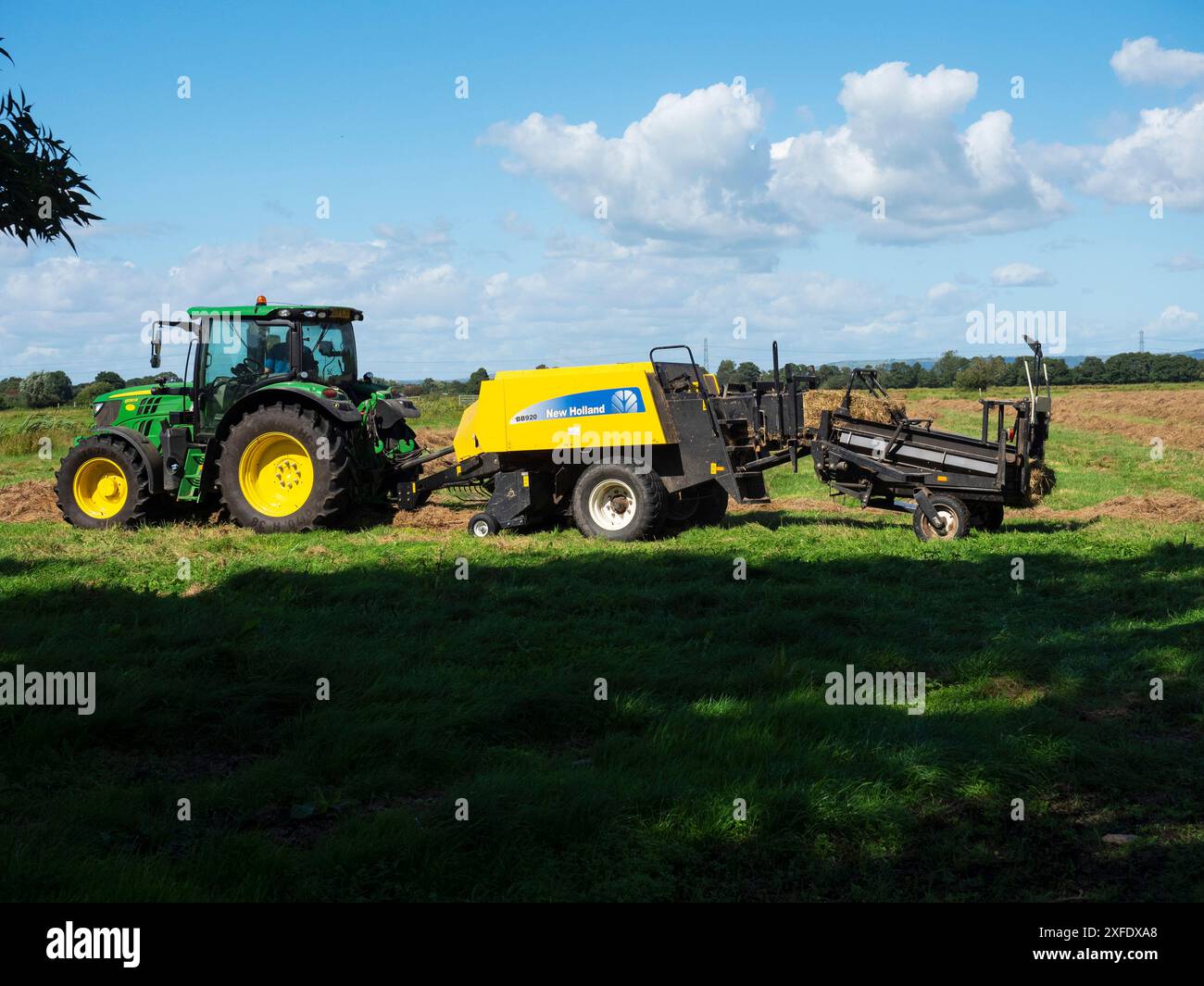 Farmer baling hay, Catcott Lows Nature Reserve, Somerset Levels and ...