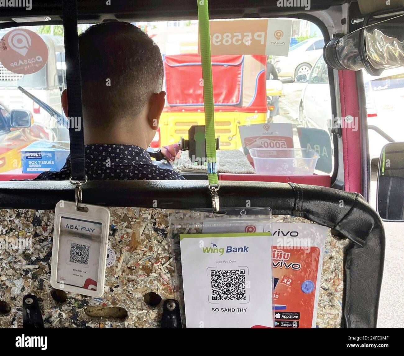 QR-codes for electronic settlement tuk-tuk, a 3-wheeled taxi, in Phnom ...