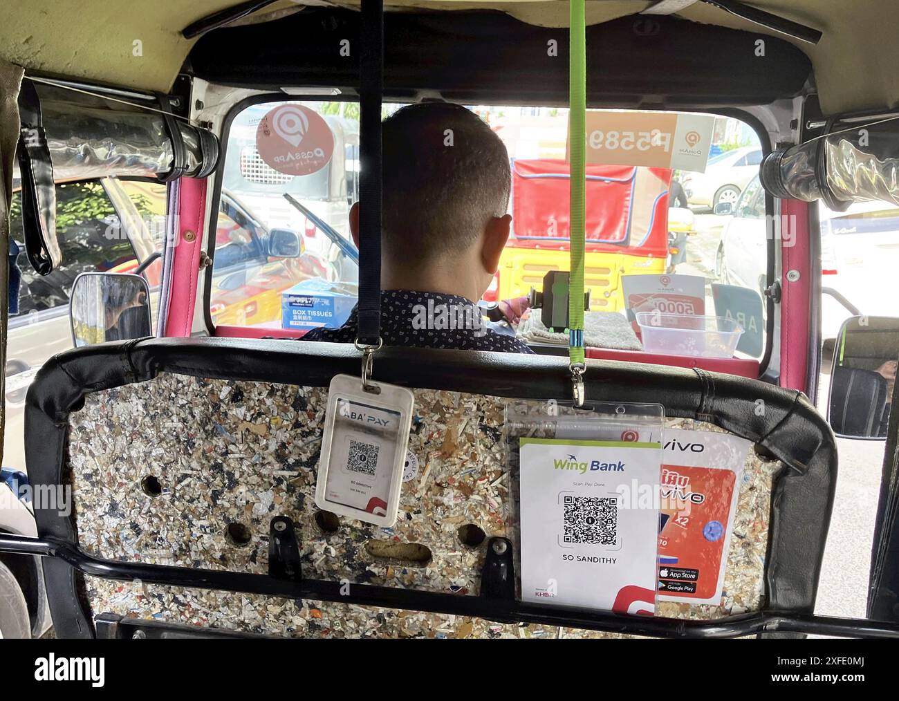 QR-codes for electronic settlement tuk-tuk, a 3-wheeled taxi, in Phnom ...