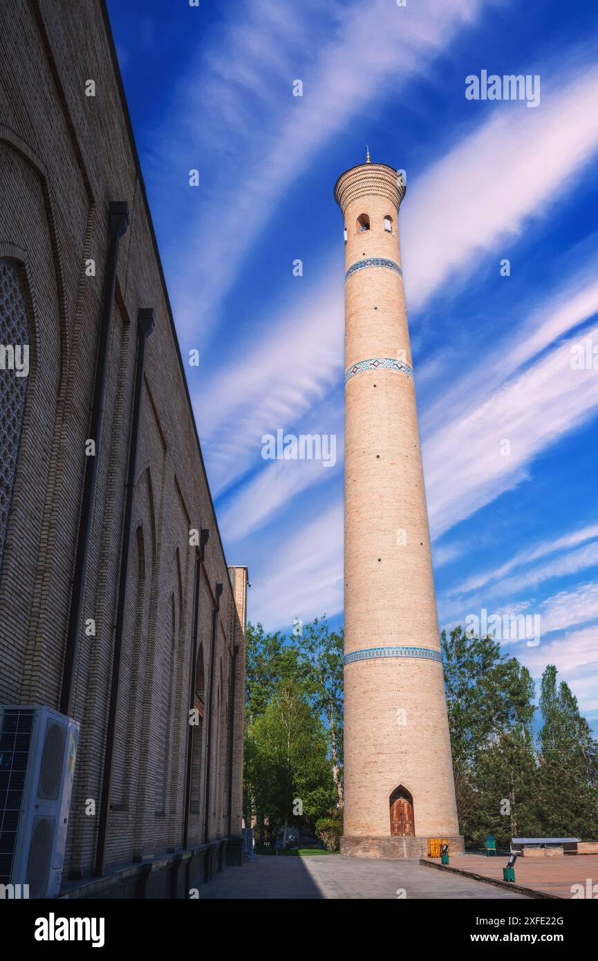 ancient old minaret of the Hast Imam mosque on background at blue sky ...