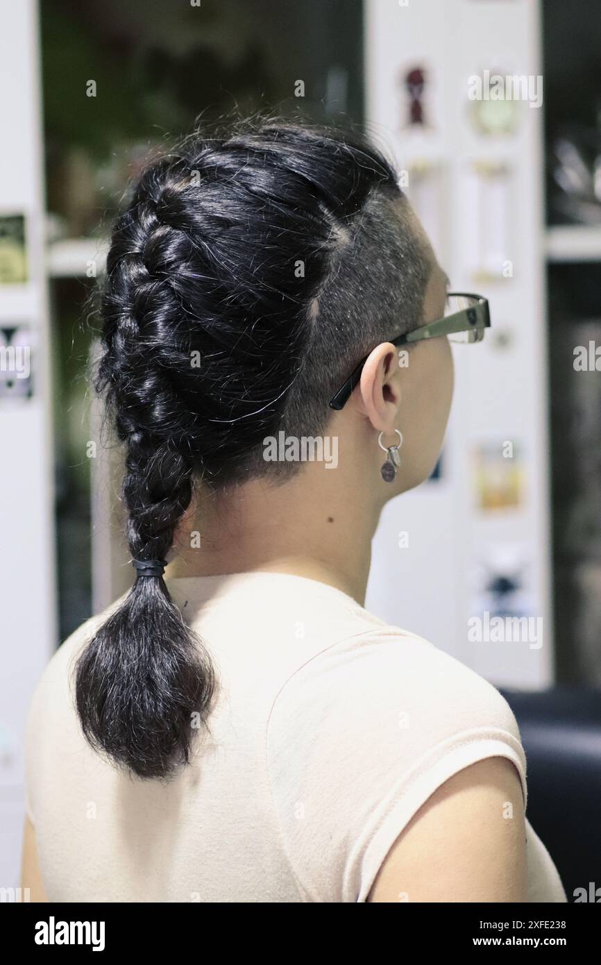 Portrait Of A Girl In Glasses With Shaved Temples And A Braid Dark