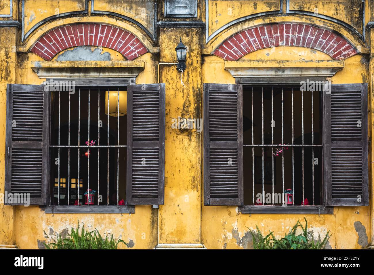 Two old windows with wooden frames and shutters, a fragment of the ...
