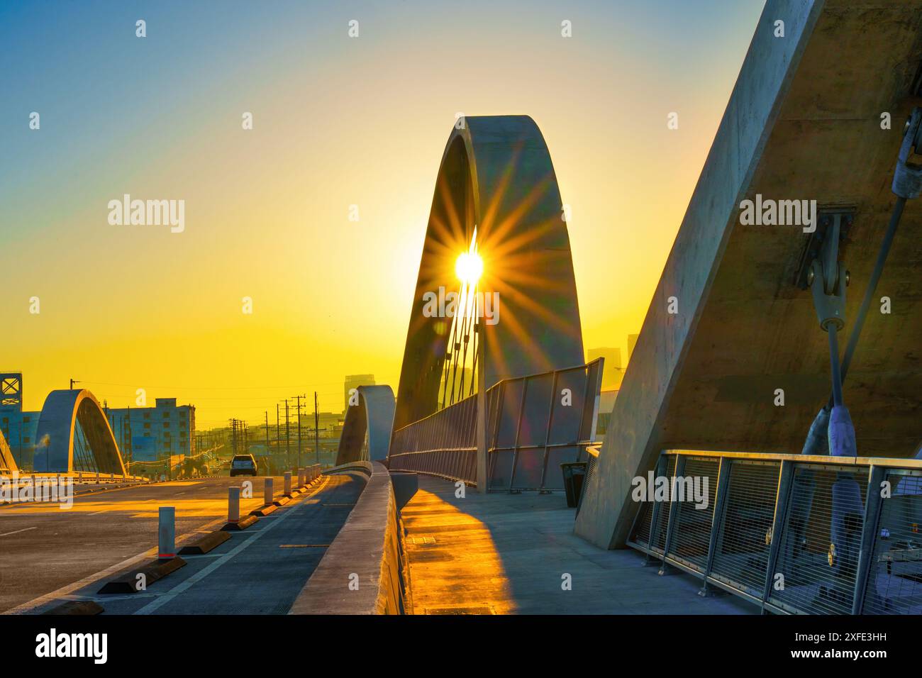 Visually striking sunset captured through the center of a modern arch ...