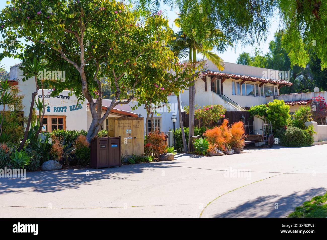 San Diego, California - April 16, 2024: Shaded pathway lined with trees ...