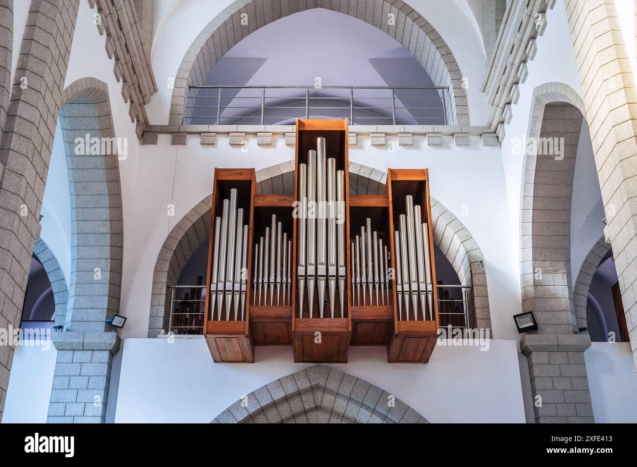 pipes of church organ inside interior of a Christian Catholic church ...