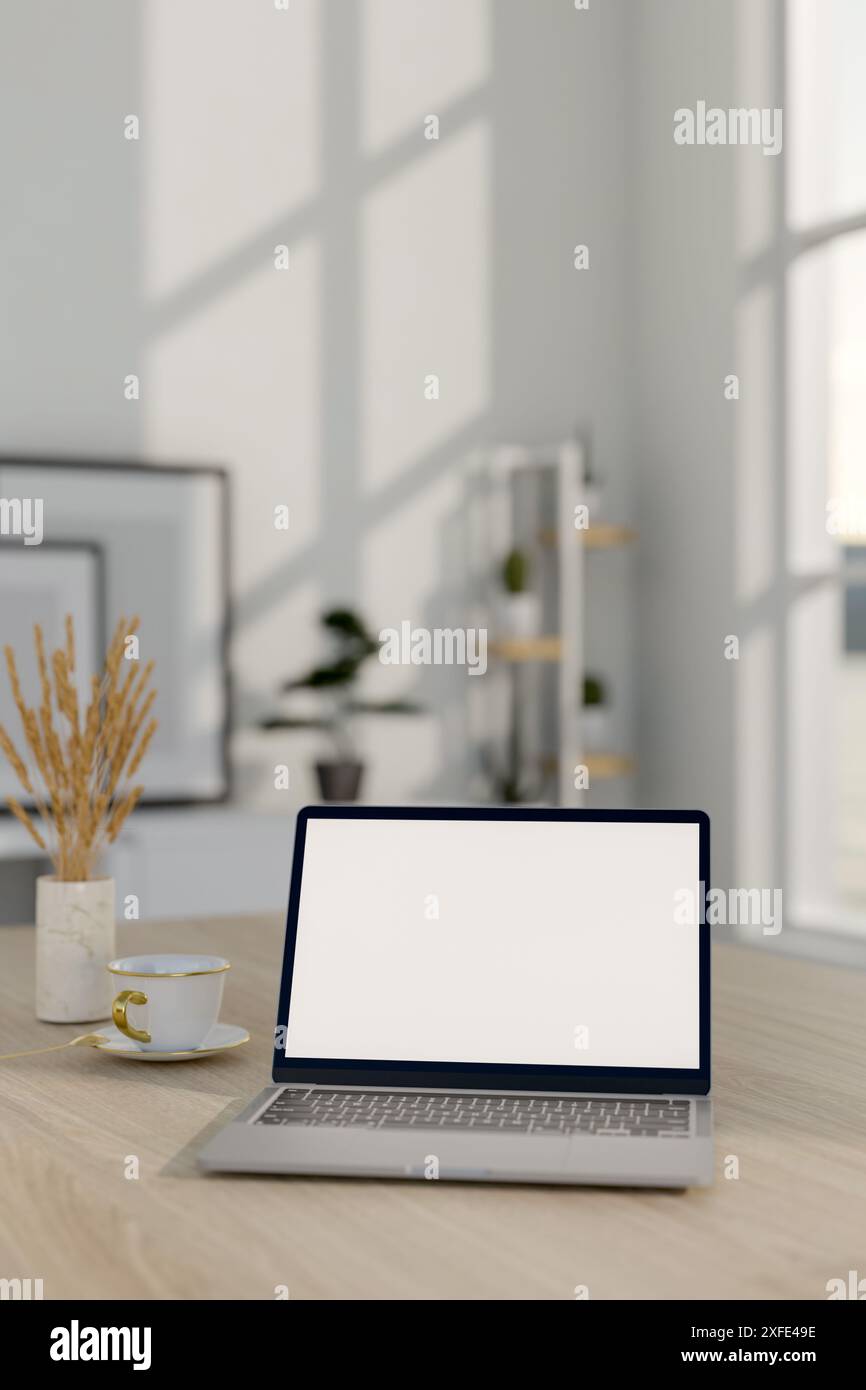 A close-up image of a laptop computer with a white-screen mockup, a ...