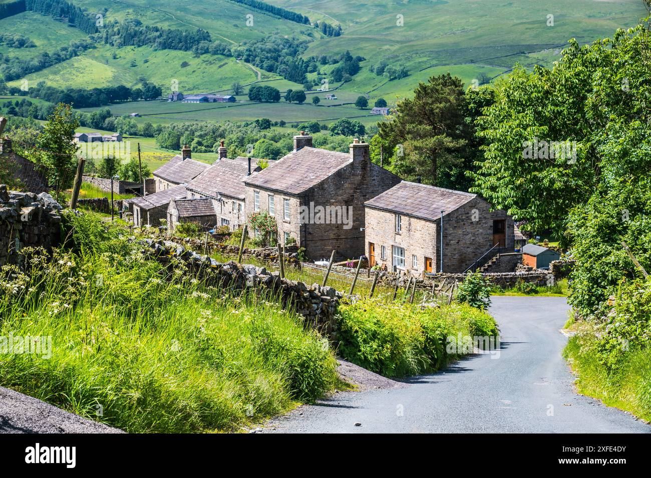 Road and cottages in Stalling Busk Stock Photo - Alamy