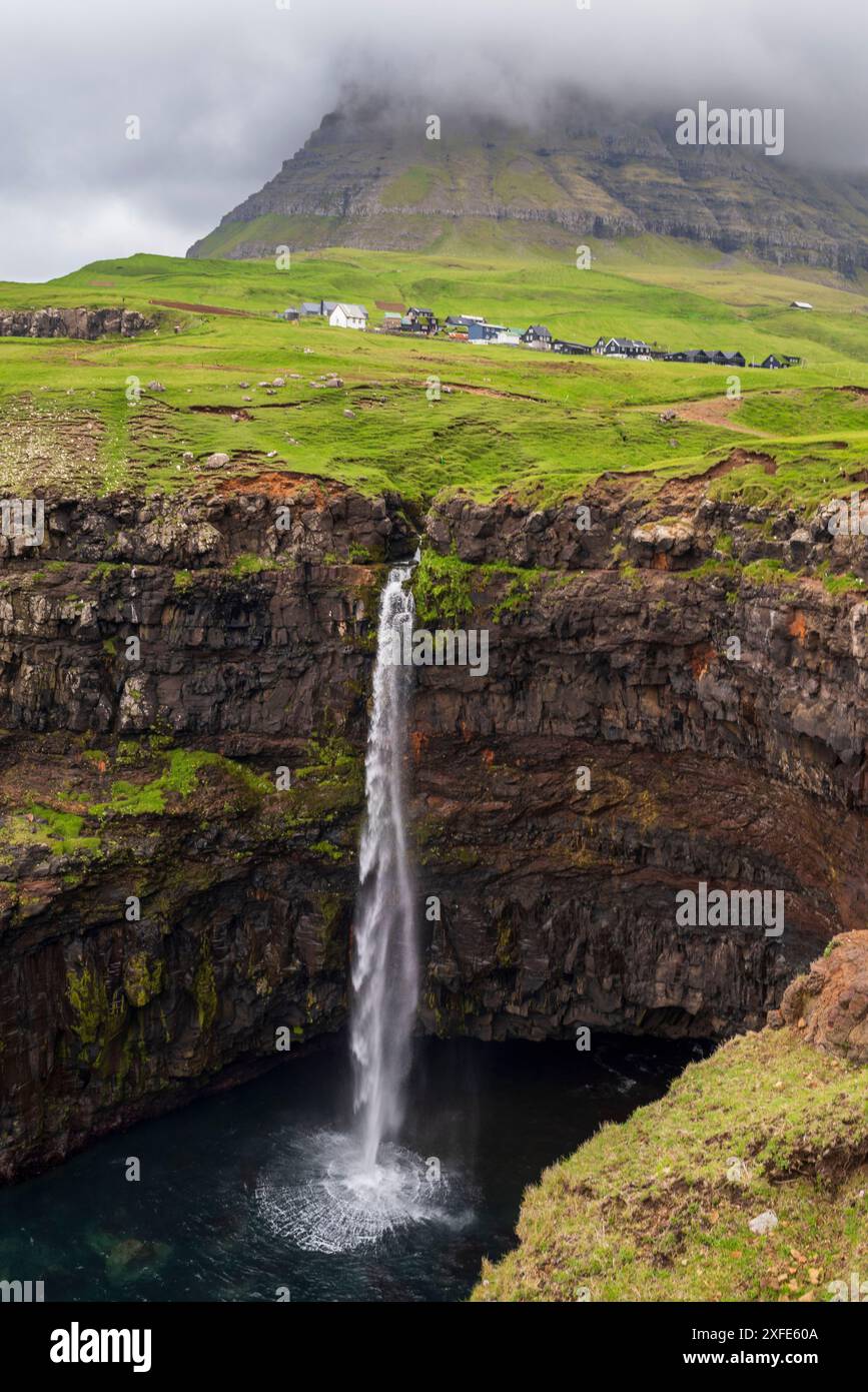 Denmark, Faroe Islands, Vagar island, Gasadalur, village and waterfall ...
