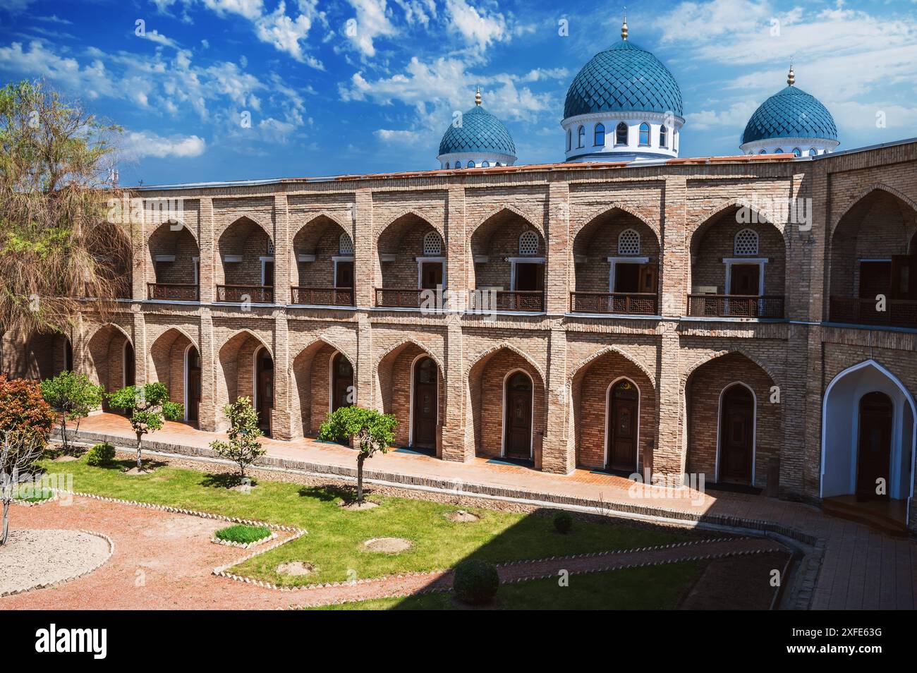 courtyard with cells of ancient Uzbek islamic Kukeldash madrasah in ...