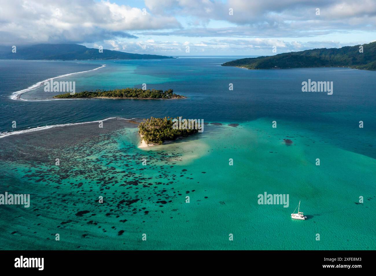 French Polynesia, Society Islands, island of Tahaa, cruise ship anchored at Motu Mahaea (aerial ...