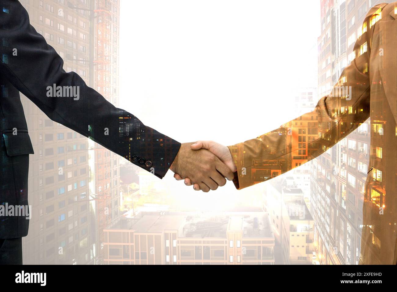 Two business people in suit are shaking hand, symbolizing agreement and partnership, with high ...