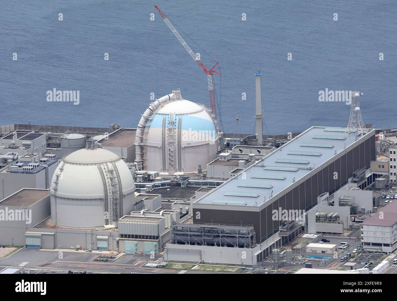 An aerial photo shows Unit 3 and 4 of Genkai Nuclear Power Station in ...