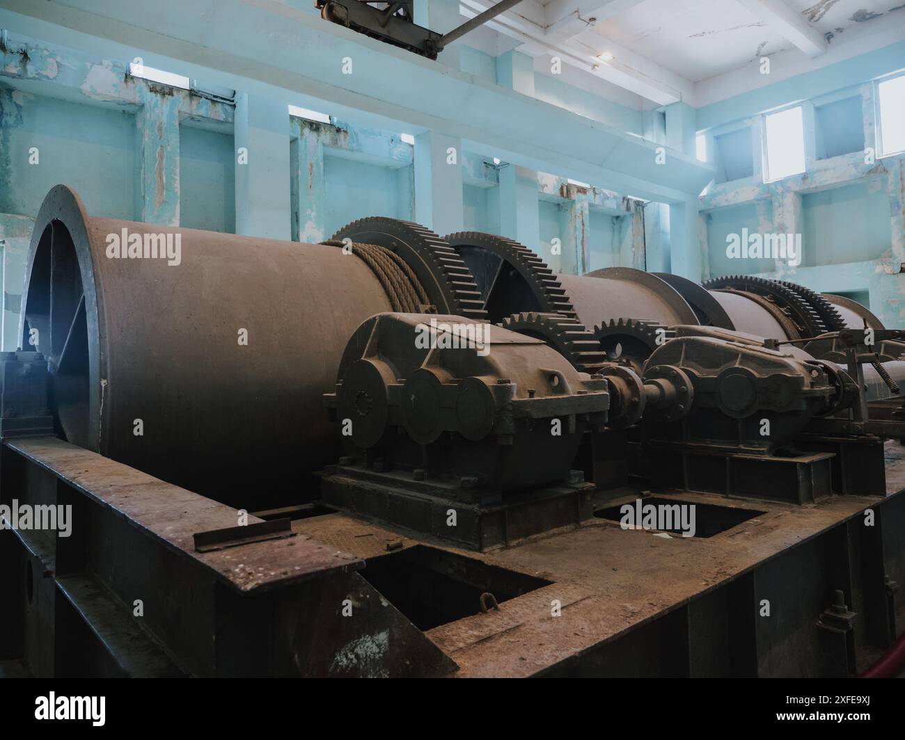 Massive industrial machinery in aged hydroelectric power station ...