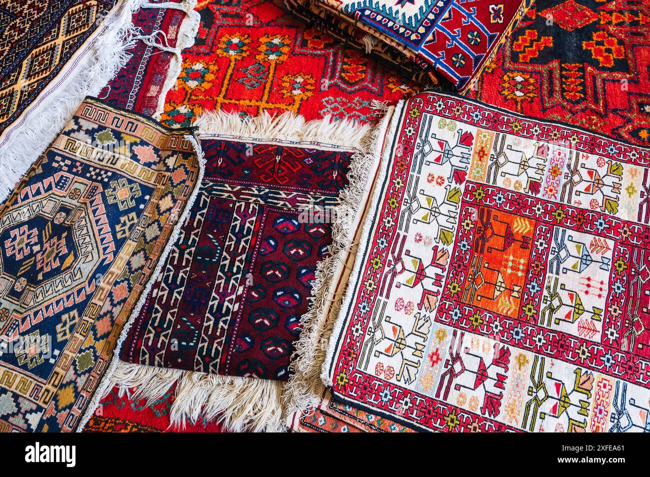 traditional oriental Uzbek handmade red carpets at the market in ...