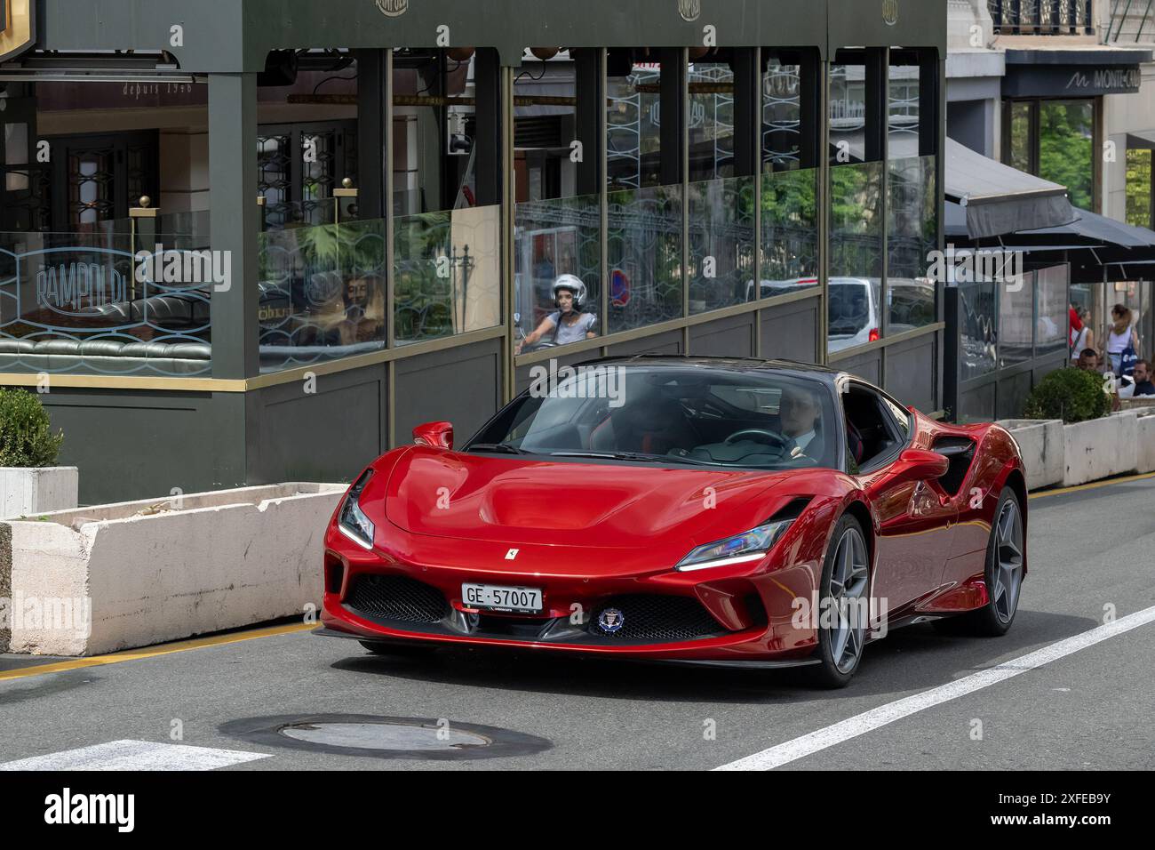 Monte Carlo, Monaco - View on a red Ferrari F8 Tributo driving on a ...