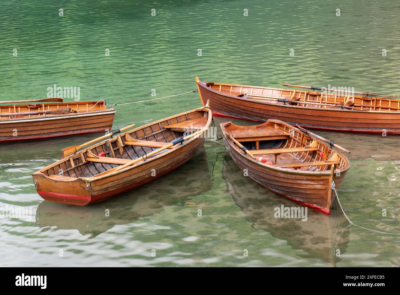 Wooden boats on the lake Braies. Tourist, famous place in the Dolomites ...