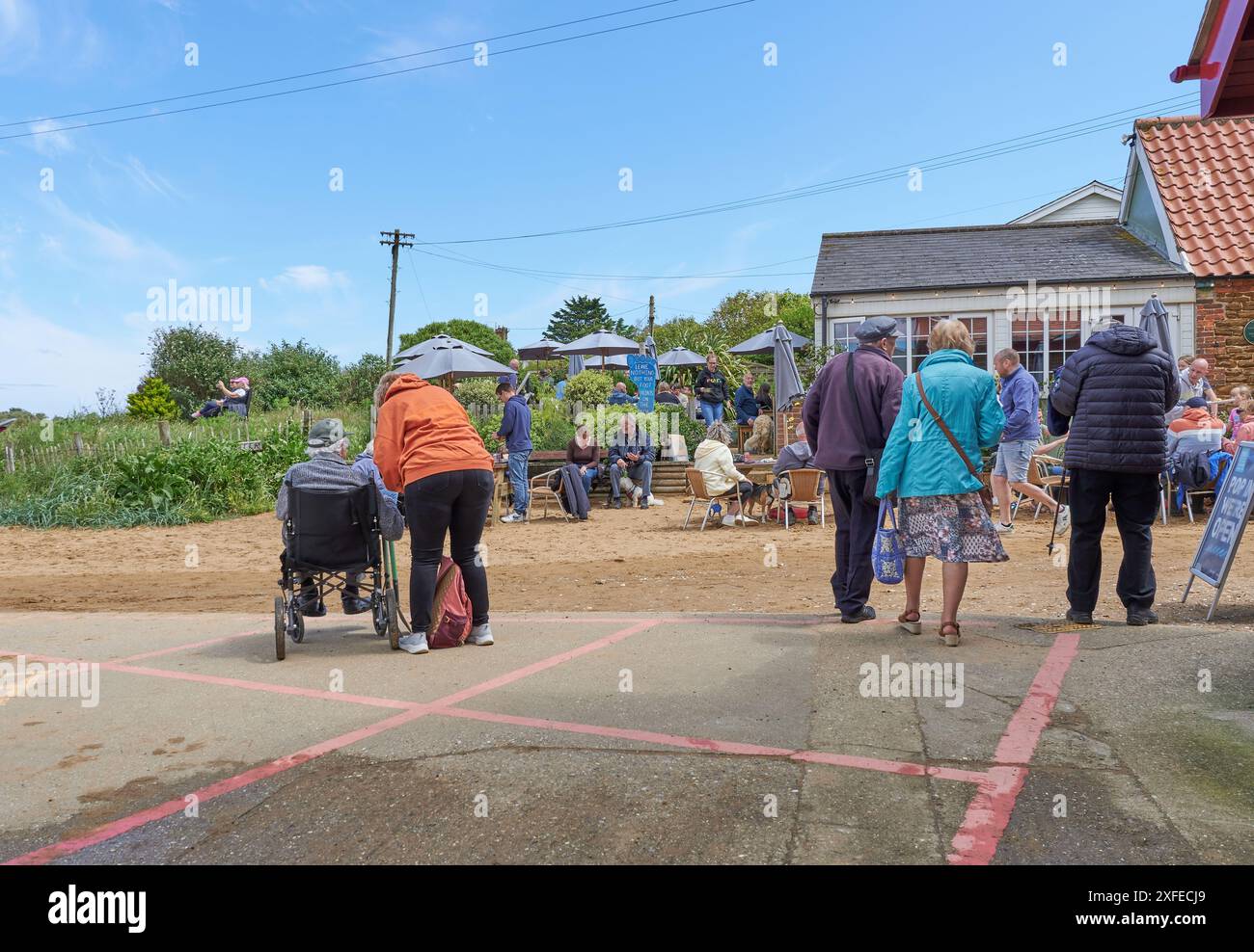 People outside a beach cafe in Old Hunstanton, Norfolk, UKfolk Stock ...