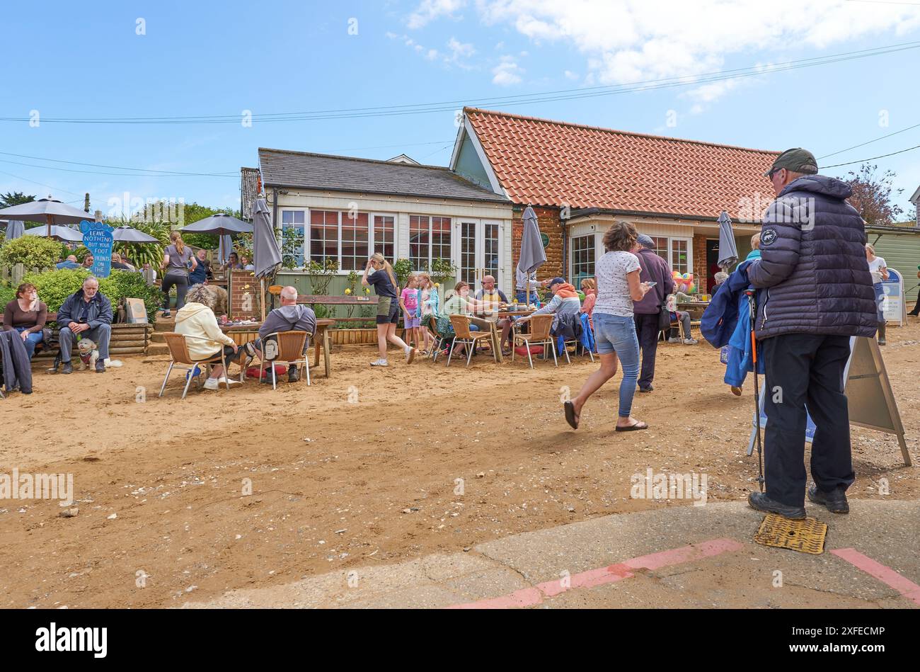 People outside a beach cafe in Old Hunstanton, Norfolk, UKfolk Stock ...