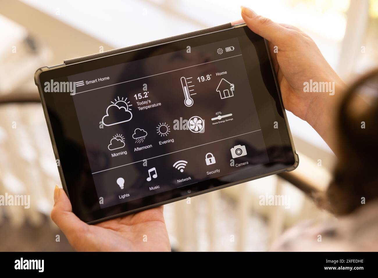 Using tablet to control smart home system, adjusting temperature and ...