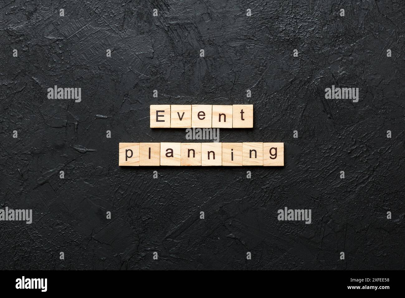 Event planning word written on wood block. Event planning text on table ...