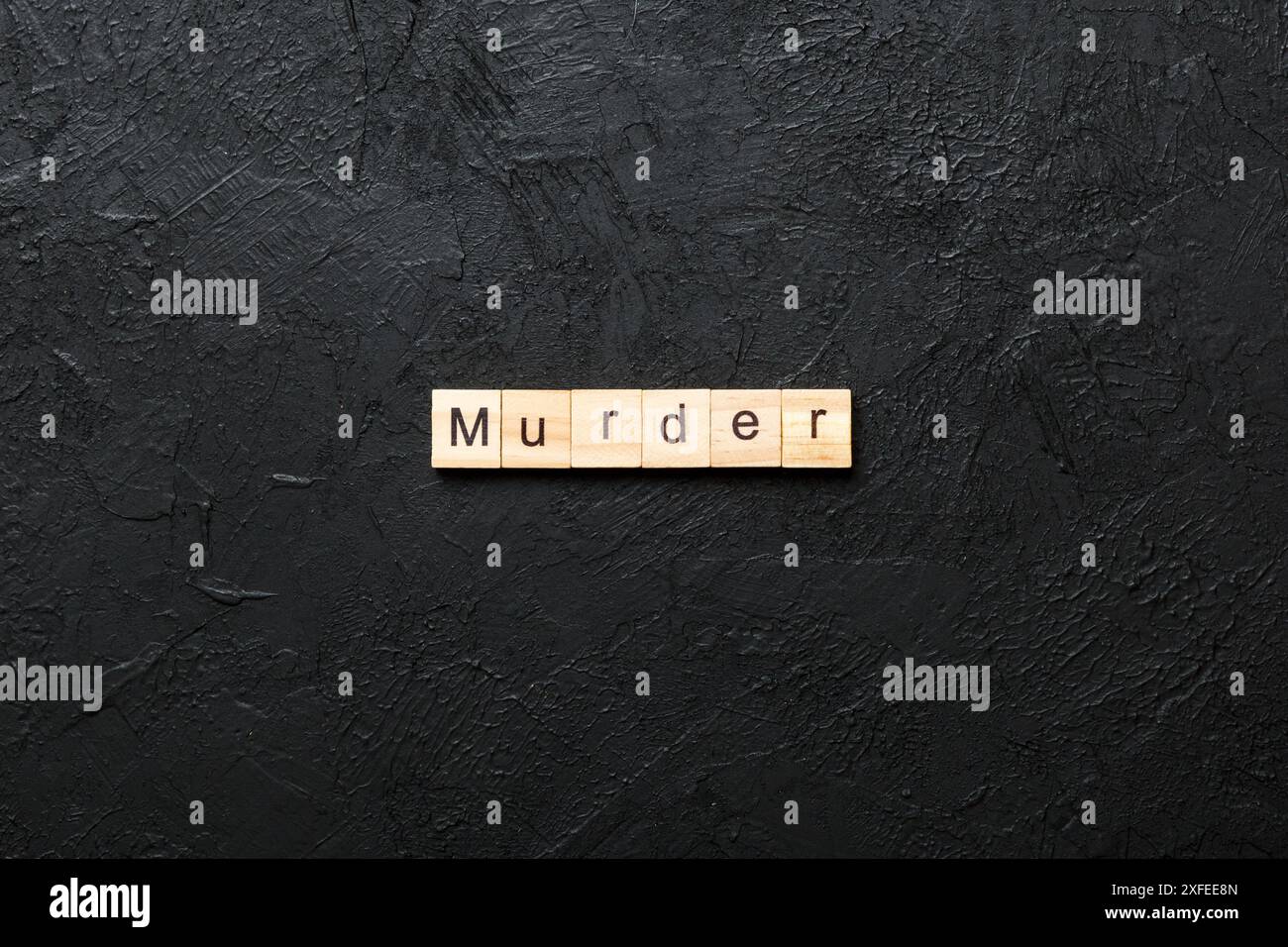 murder word written on wood block. murder text on table, concept Stock ...