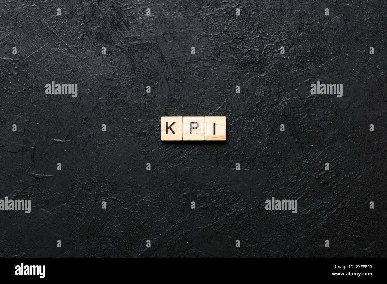 kpi word written on wood block. key performance indicators text on ...